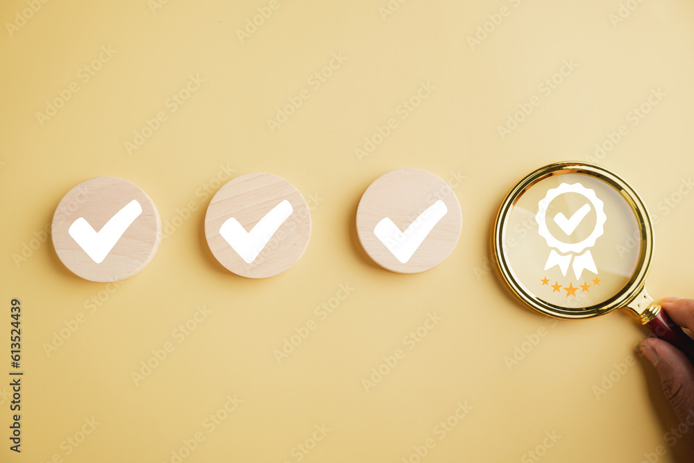 Magnifying glass focuses on five-star and quality warranty icon ...