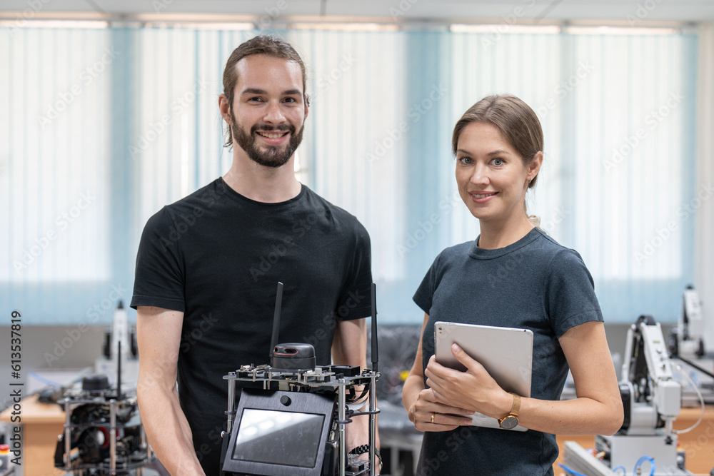 Portrait of male and female engineers researchers testing and ...
