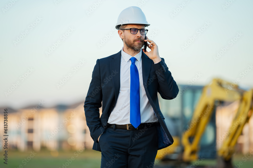 Successful construction business owner. Construction worker in suit and ...