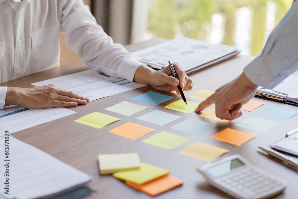 Business People brainstorming Meeting Design Ideas use post it notes to ...