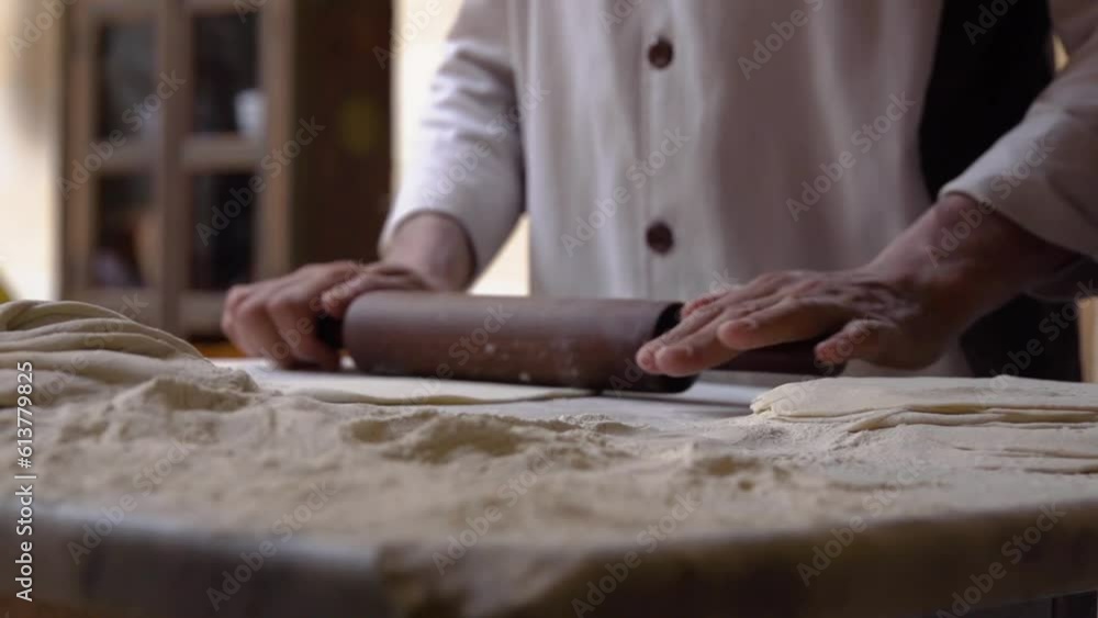 Dough Being Rolled in Slow Motion By Baker in Traditional Bakery vídeo ...