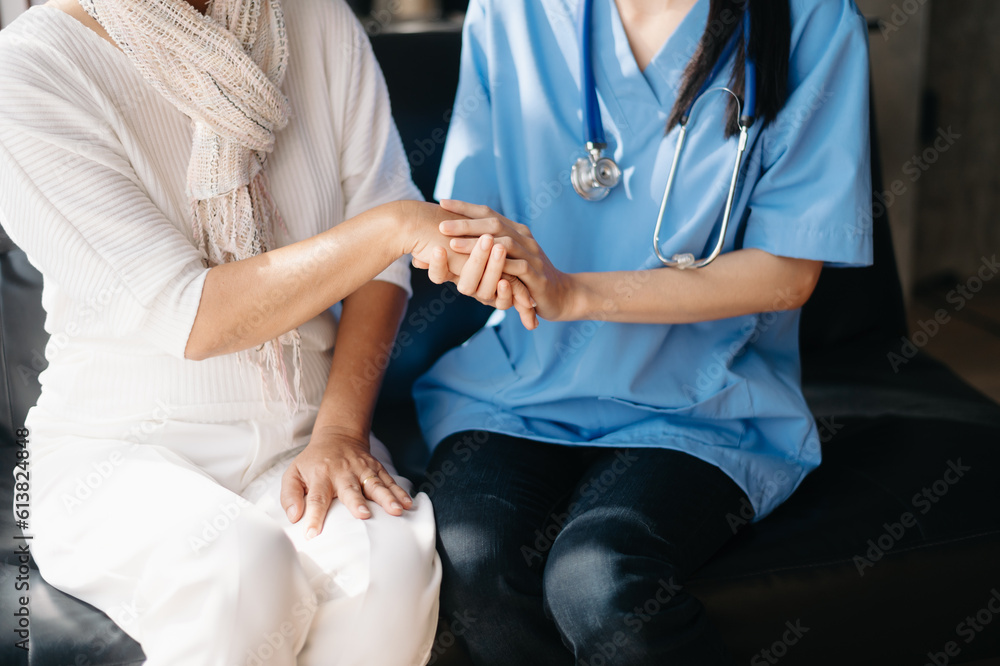 medical doctor holing patient's hands and comforting her.Kind doctor ...
