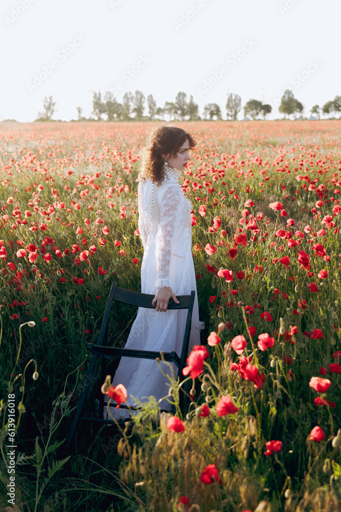 A beautiful girl in a vintage white dress, as a model, at a fashion ...