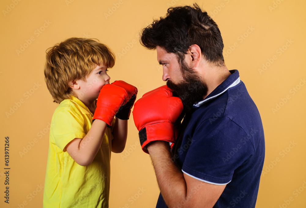 Little boy with boxing trainer. Boy boxer practicing punches with coach ...