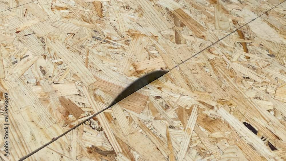 OSB Oriented strand board plate being cut by circular saw disk Stock ...