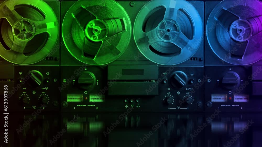 Vintage tape recorder roller. Audio reel tape is rotating at an old ...