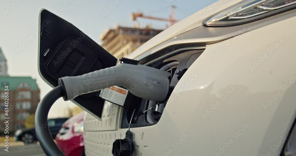 Electric Vehicle Charging Port Plugging in EV Modern Car. Electrical ...