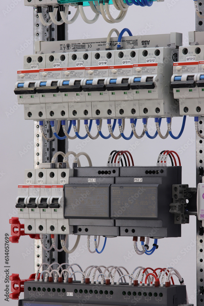 Electric circuit breakers installed on a din rail in an electric ...