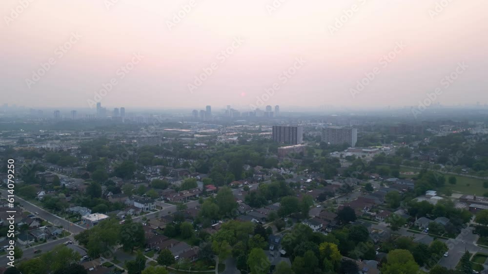 Sunset haze blanketed by wildfire smoke causing low visibility and poor ...