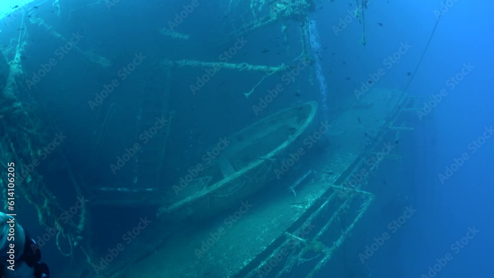 Scuba divers swims on the Shipwreck. Wreck diving. Mediterranean sea ...