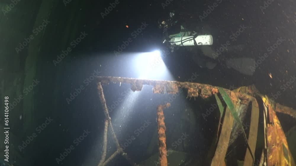 Scuba divers swims on the Shipwreck. Wreck diving. Mediterranean sea ...