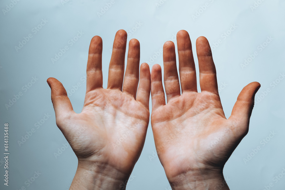 Dirty caucasian hands isolated on a white background. Pair dyed palms ...