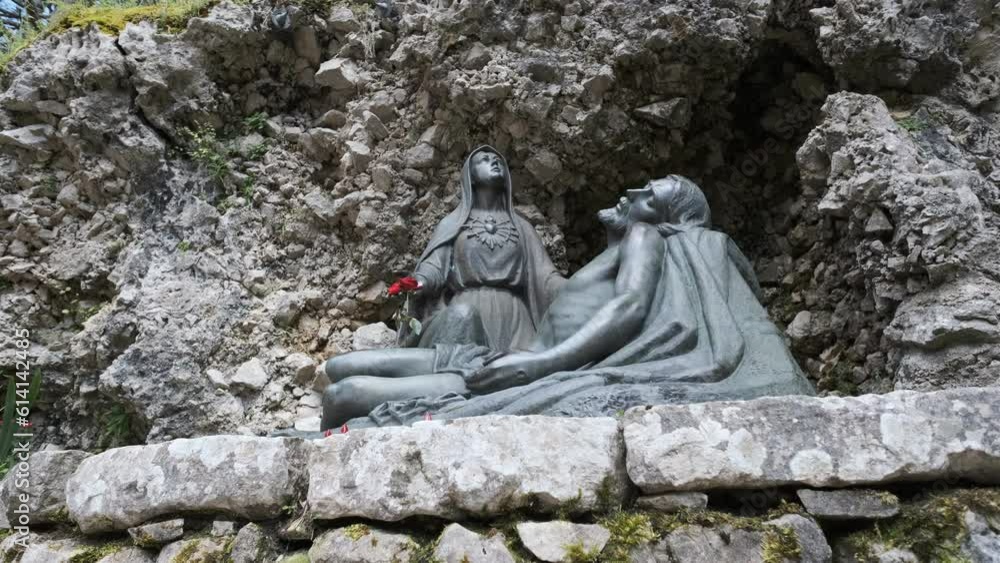 Bronze statue of the Madonna and dead Jesus, shot from below with a ...