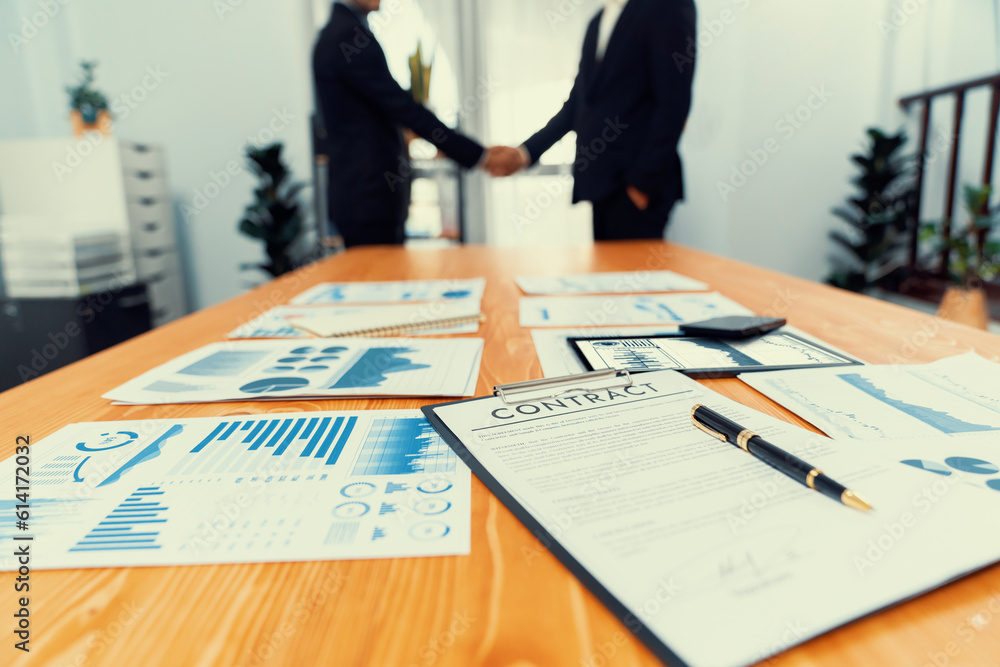 Closeup professional businessman shaking hands over desk in modern ...