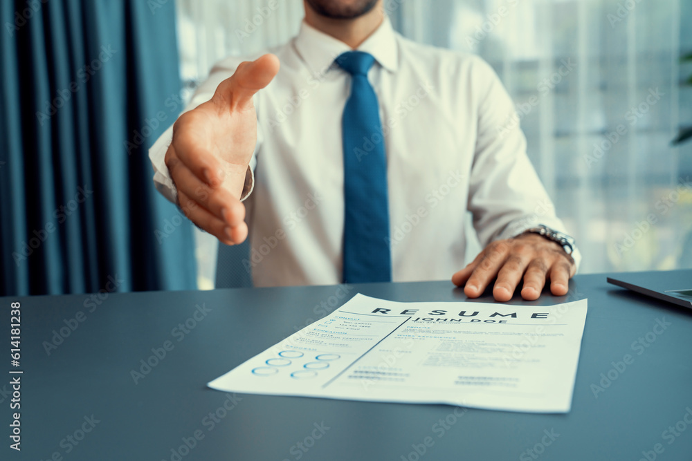 Confident man wearing suit in formal office, with resume paper for job ...