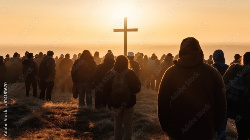 multitude of people looking towards a cross on the horizon Stock ...