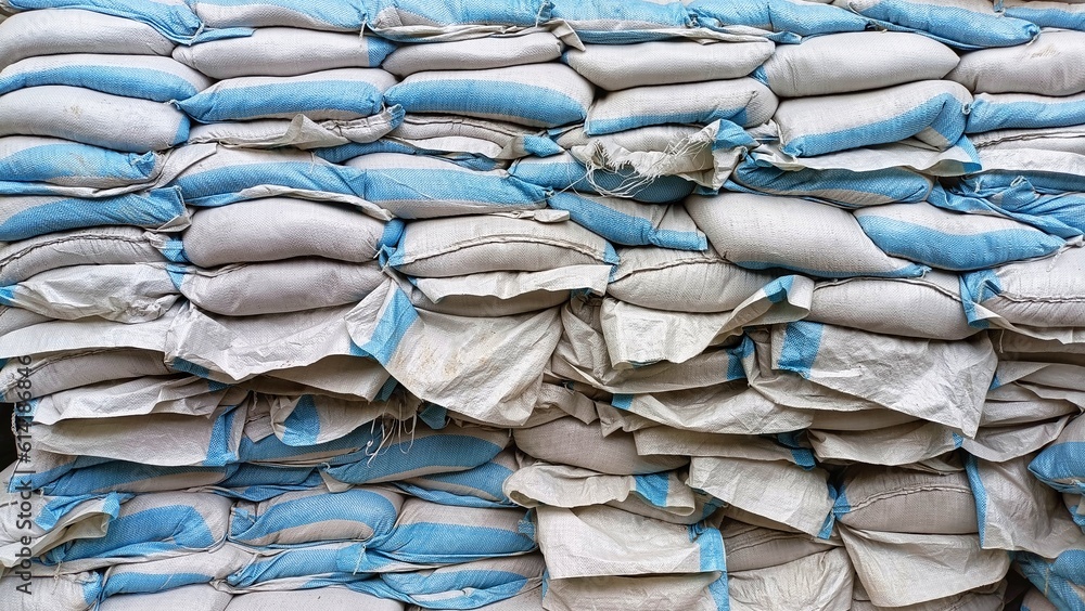 Sand in plastic bag, stack of sand bag wall, water flood protection in ...