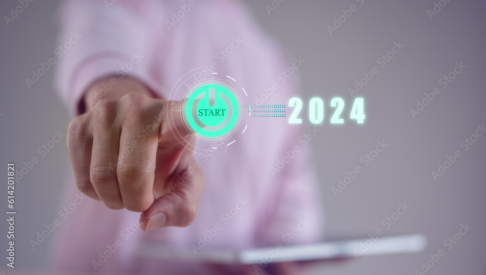 man touching on virtual screen start button for 2024 New Year, Start ...