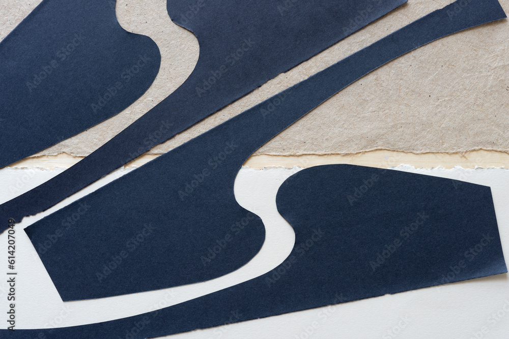 cut black paper shapes with rounded and wavy edges somewhat reminiscent ...