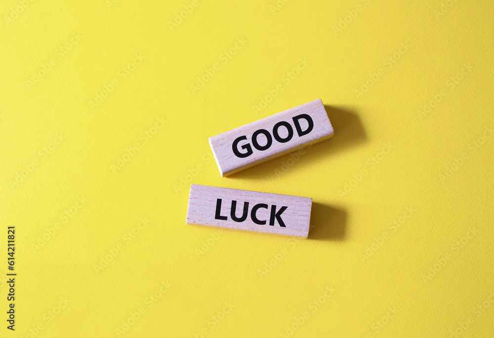 Good luck symbol. Wooden blocks with words Good luck. Beautiful yellow ...