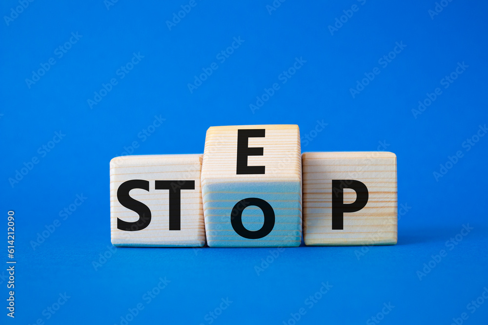 Step vs Stop symbol. Wooden cubes with words Stop and Step. Beautiful ...