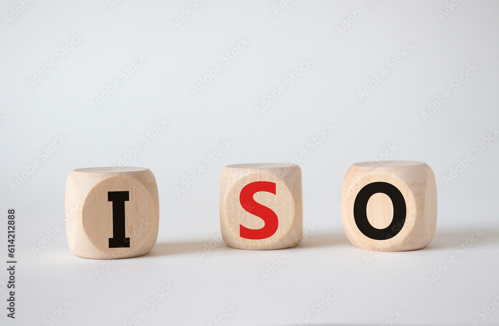 ISO standards quality control symbol. Concept word ISO on wooden cubes ...