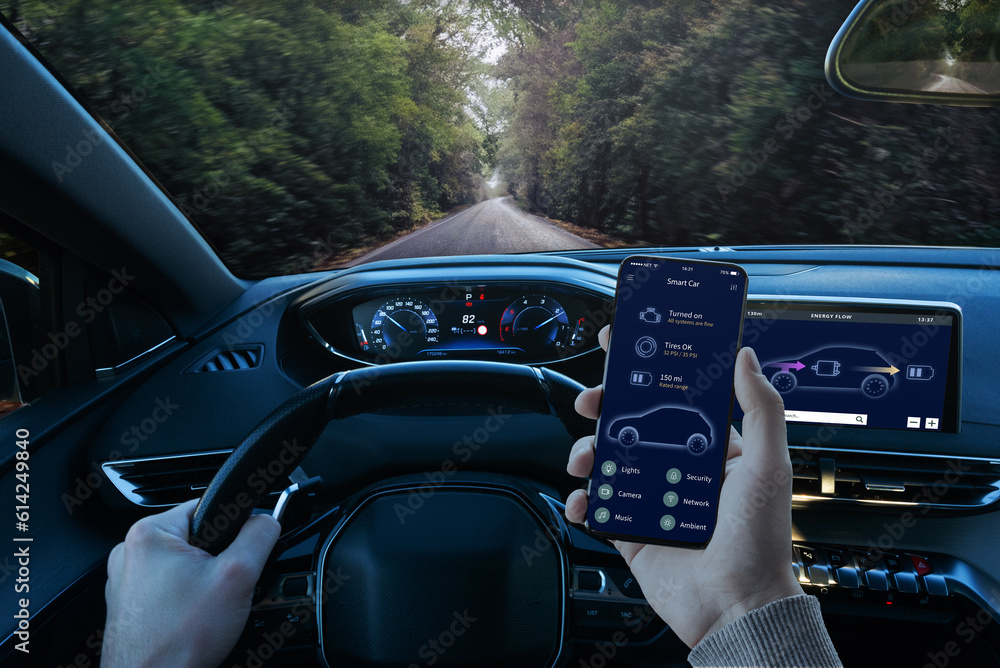 Driver uses the smart car appwhile driving, in order to read the ...