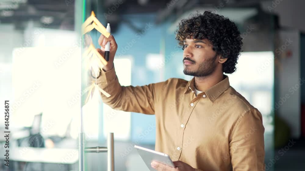 Young creative entrepreneur business man in office uses post papers ...