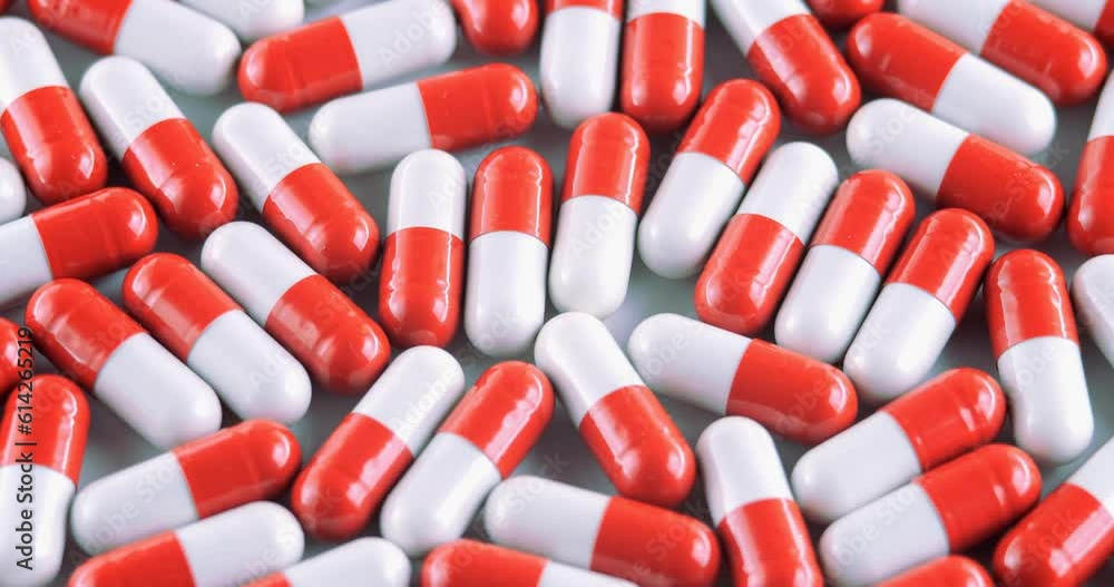 Capsule on a white background filled with medicine is in a chaotic ...