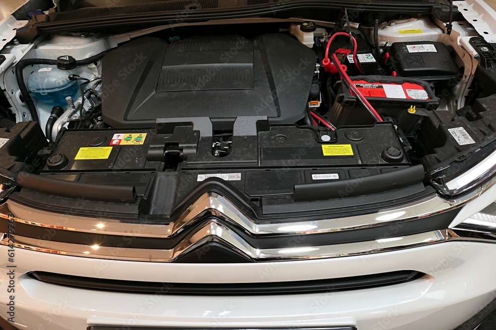 Opened front trunk with visible covered electric engine and other ...