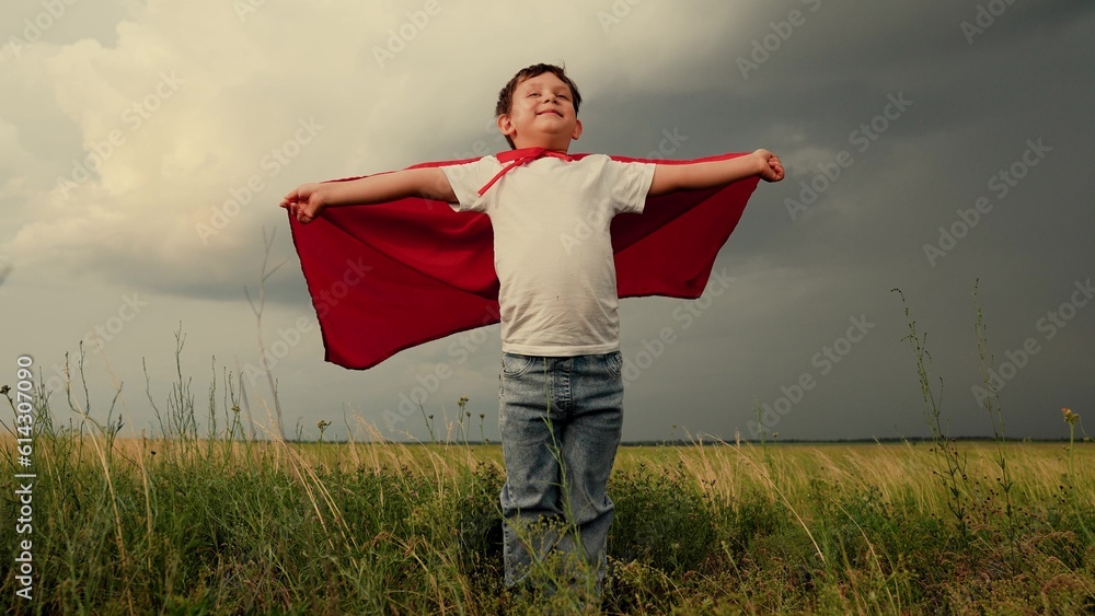Boy kid plays superhero in red cape, childhood dream. Happy child ...