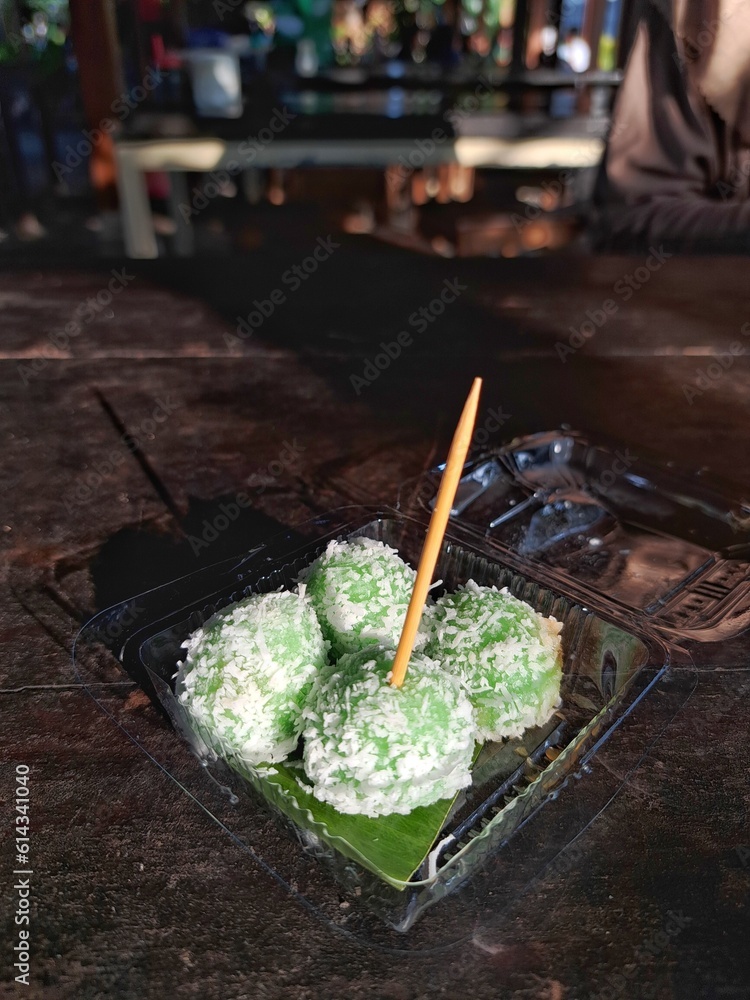 Klepon is a Javanese traditional snack of sweet rice cake balls filled ...