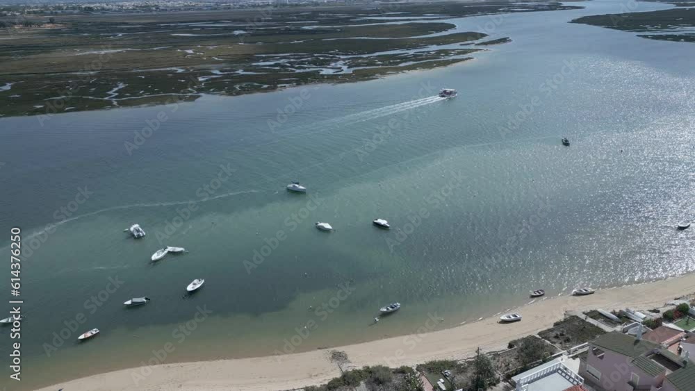 aerial view of a ferry gracefully sailing with tourists across the Ria ...