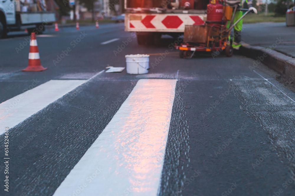 Process of making new road surface markings with a line striping ...