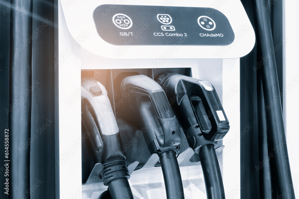 Blurred electric car charging station for charge EV battery. Plug for ...