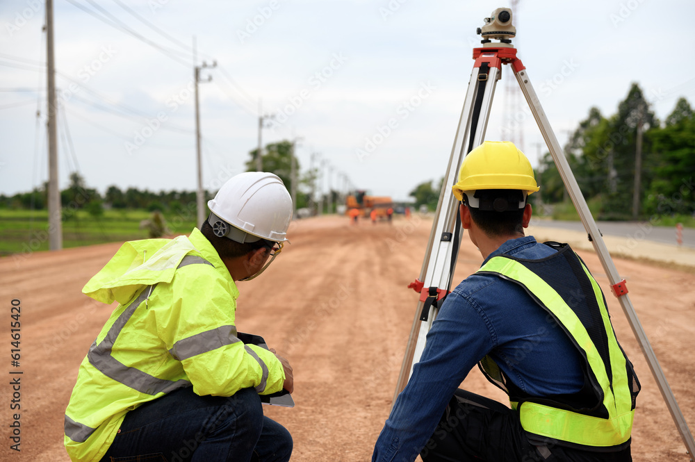 Asian surveyor engineer two people checking level of soil with Surveyor ...