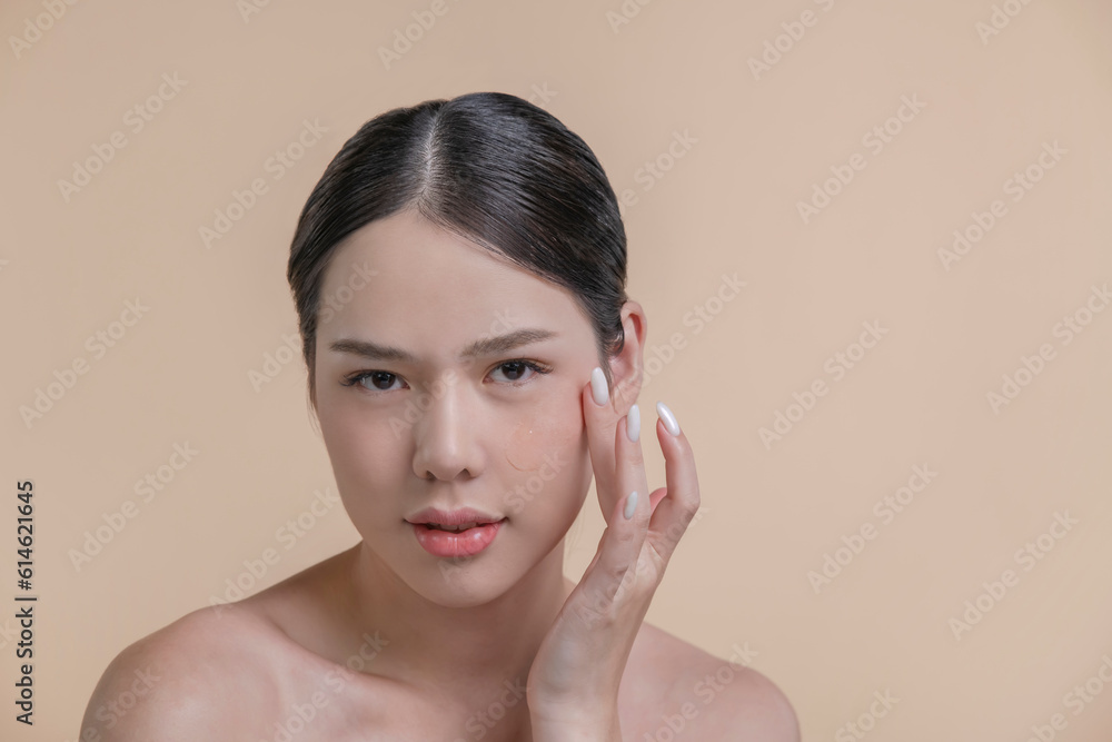 Beautiful Asian woman applying hyaluronic serum on her face. Photo of attractive woman with ...