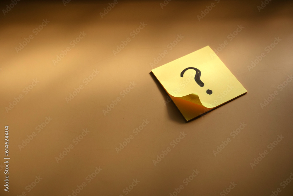 Questions and answer concept. Question mark written on paper. Brown ...