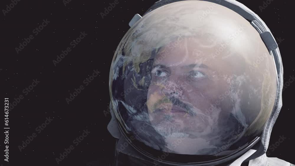 Portrait of man astronaut on Moon wearing helmet looking at earth globe ...