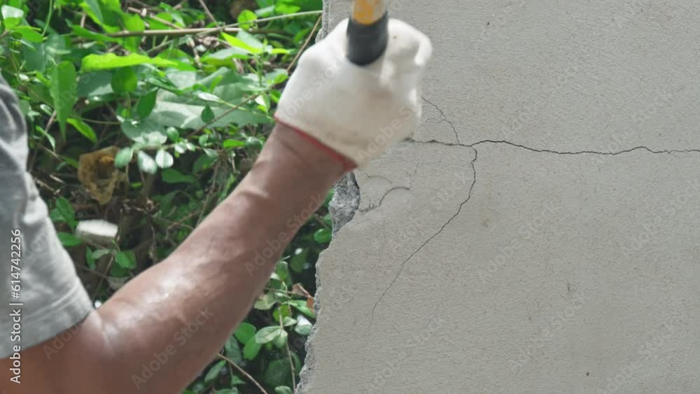 Hand of worker using hammer smashing and demolish on brick wall at ...