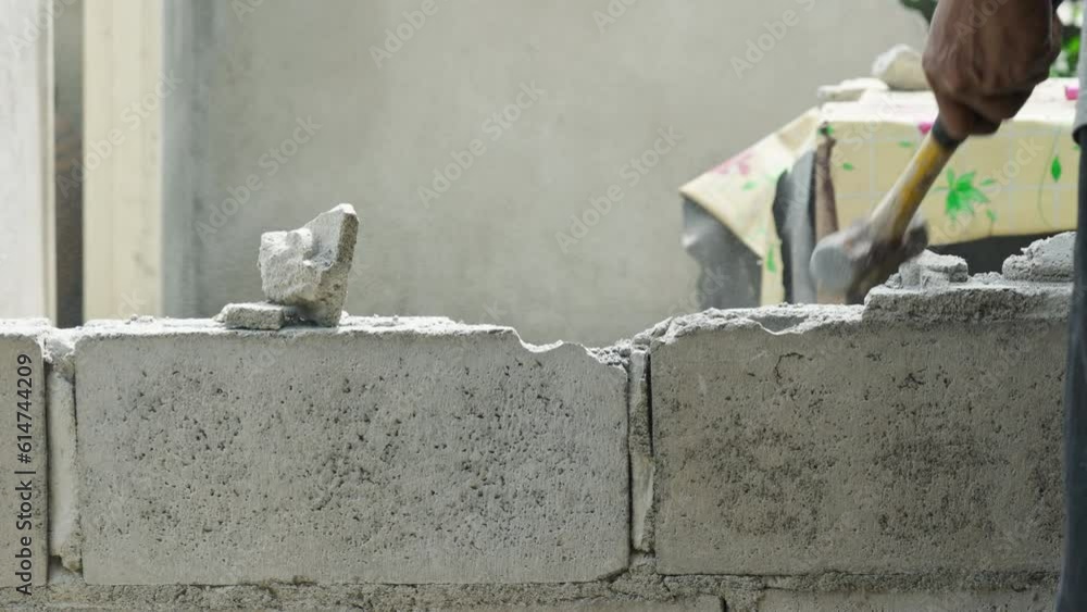 Hand of worker using hammer smashing and demolish on brick wall at ...