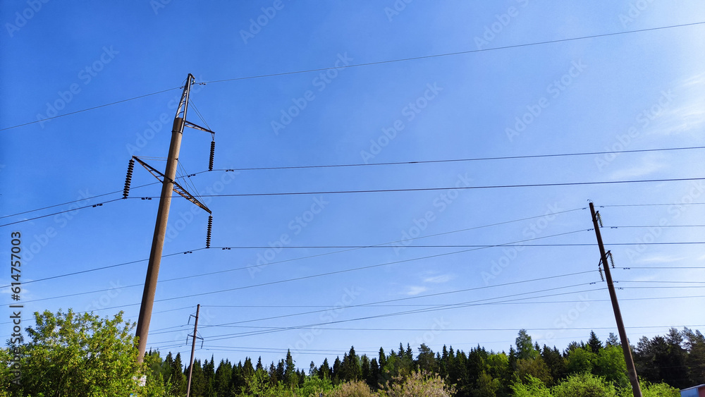 Closeup of old power poles on a clear summer day. Old hight voltage ...
