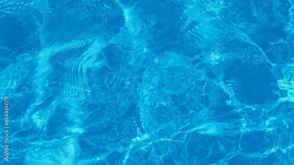 Pure bright blue transparent water in the swimming pool with light ...