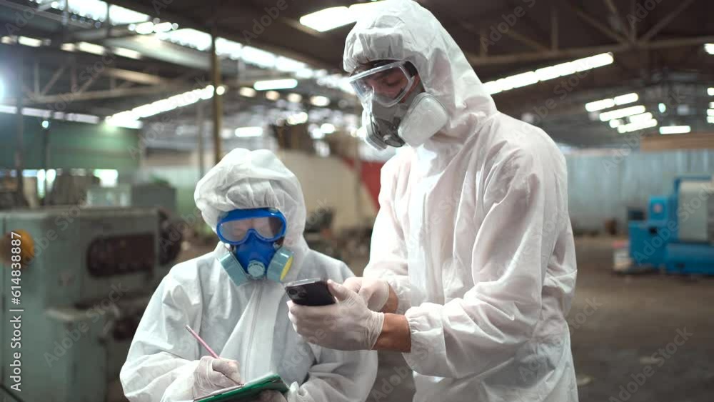 Team of scientist wearing a chemical protection suit and high ...