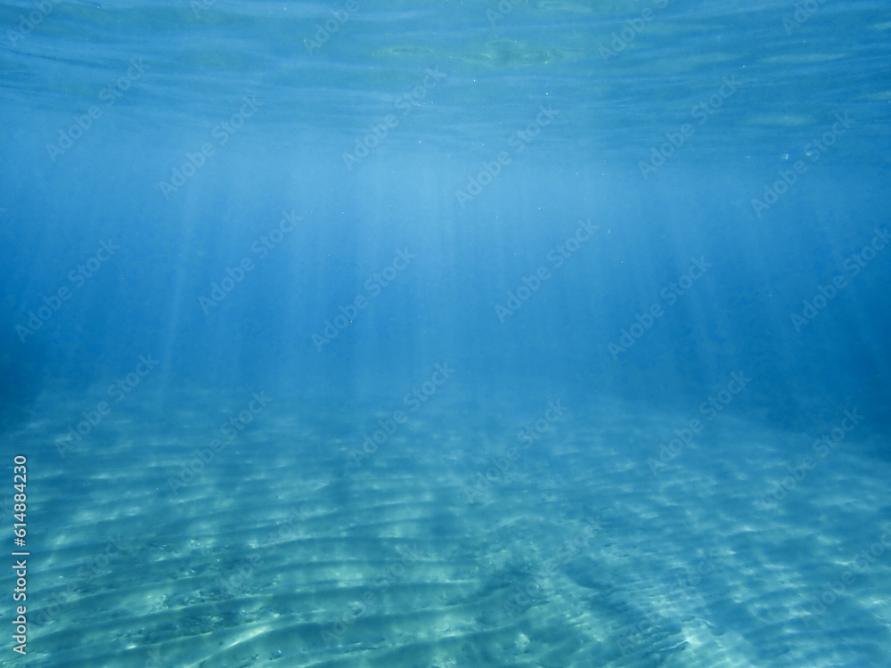Dark blue ocean surface seen from underwater. Abstract waves underwater ...