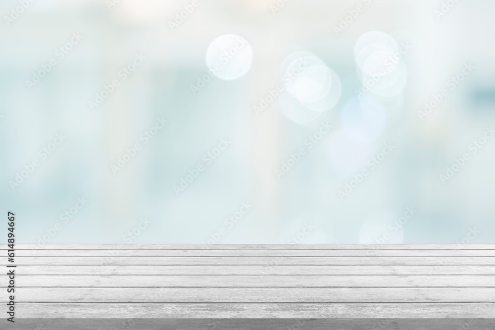 Wooden table on blur window glass wall in office room. Empty white ...