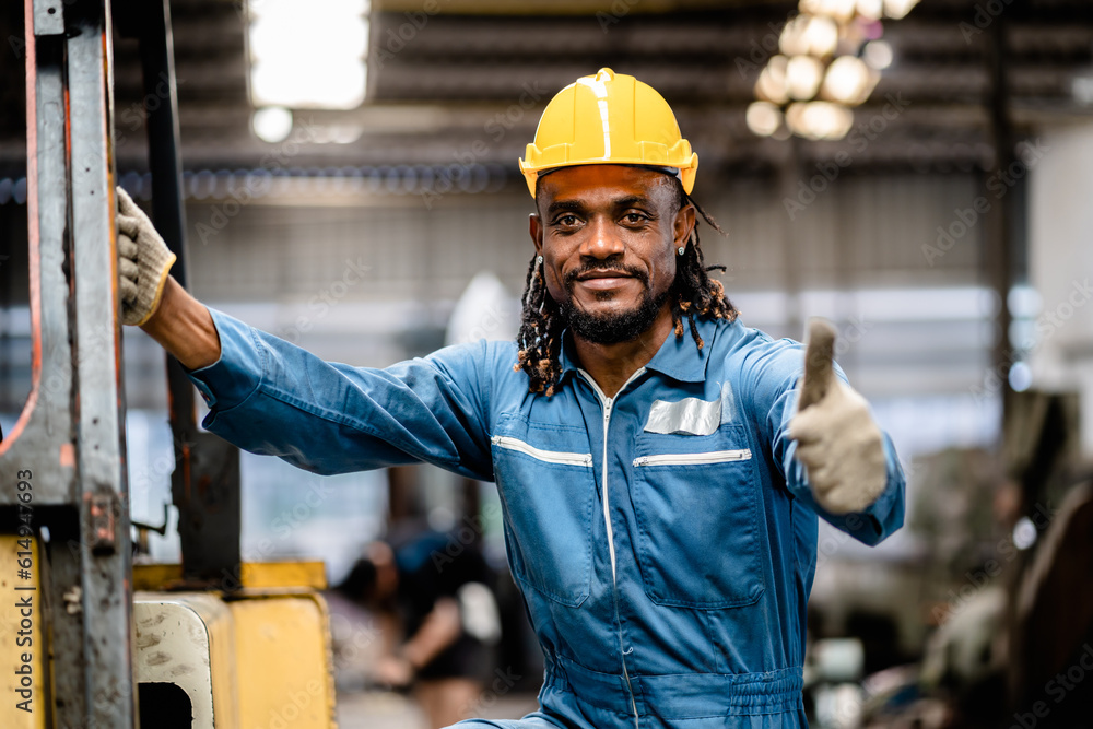 African American male worker smiling in safety uniform show thumb up in ...