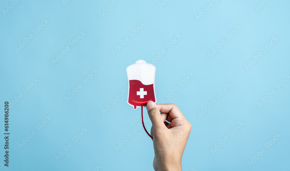 Hands holding blood drop paper cut, blood transfusion, world blood ...