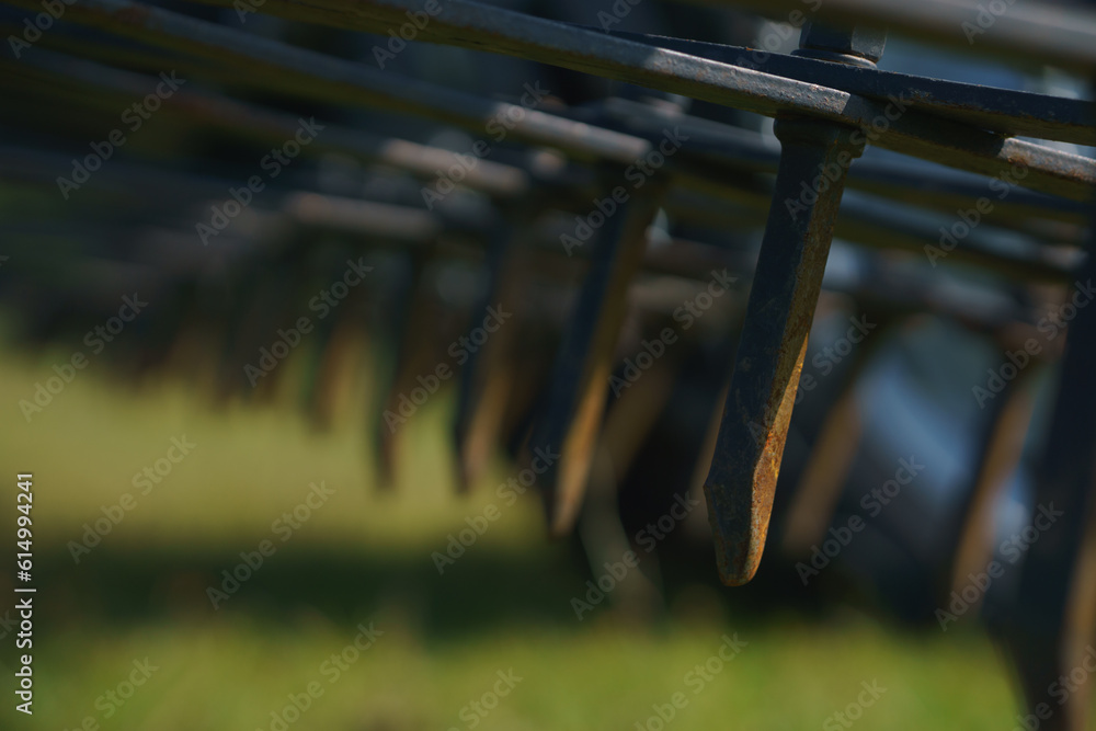 Red tractor with tooth harrow in the green field in Ukraine Stock Photo ...