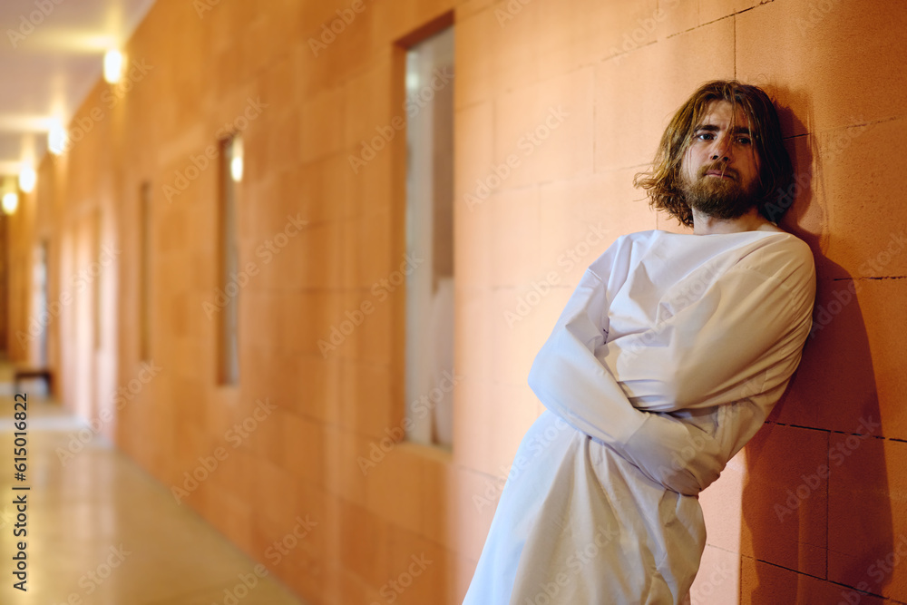 Foto de Young deranged man with schizophrenia wearing straitjacket ...